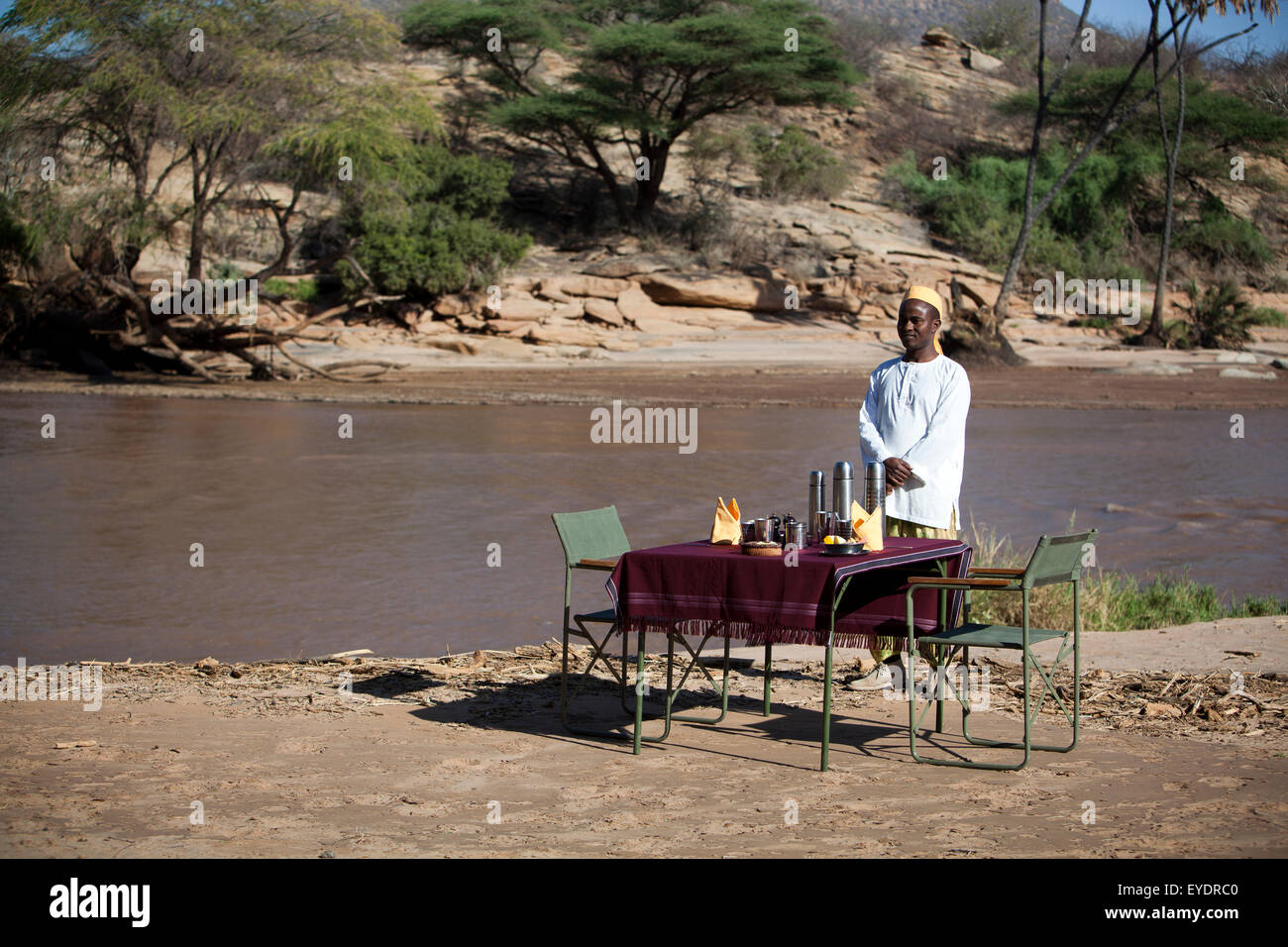 Kenya, Riverside breakfast table set up for guests at Joy's Camp; Shaba ...
