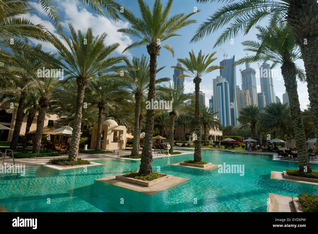 UAE, Swimming pool of the One and Only Royal Mirage with tower blocks ...