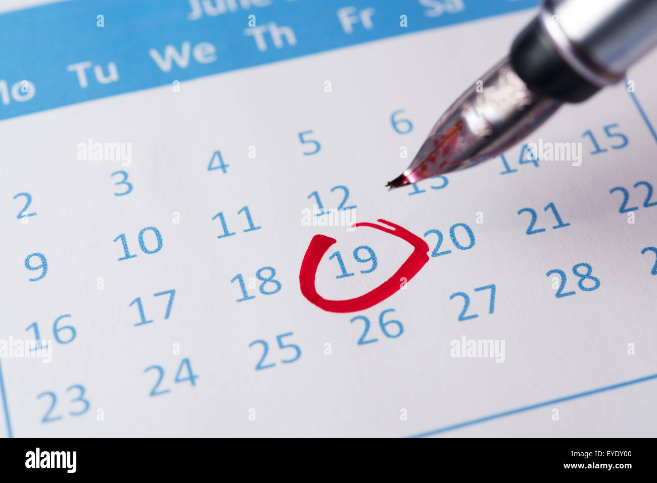 Red circle marked on a calendar with a pen Stock Photo - Alamy