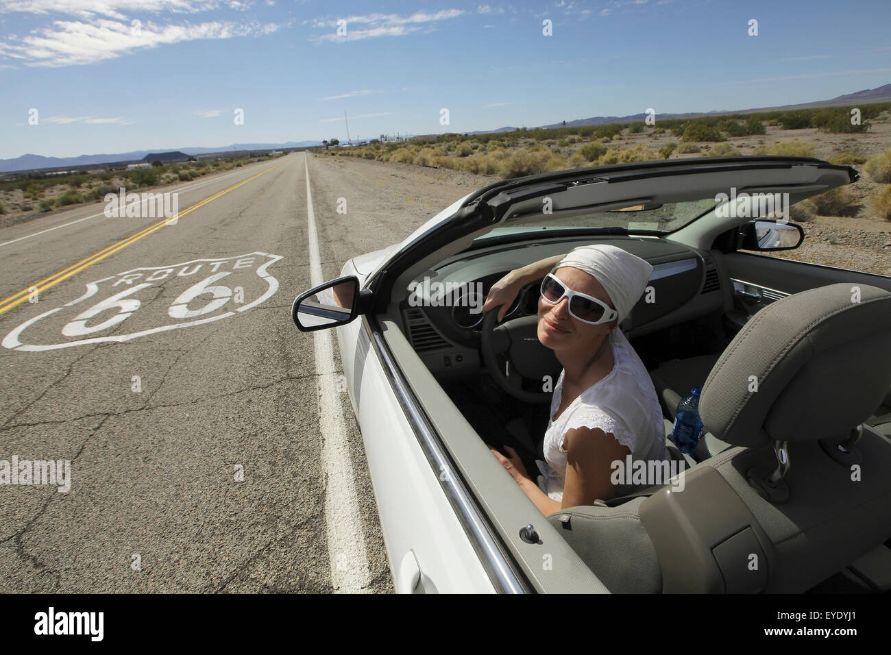 Usa, Young Woman Driving Her Convertible Car Through Desert Along Route ...