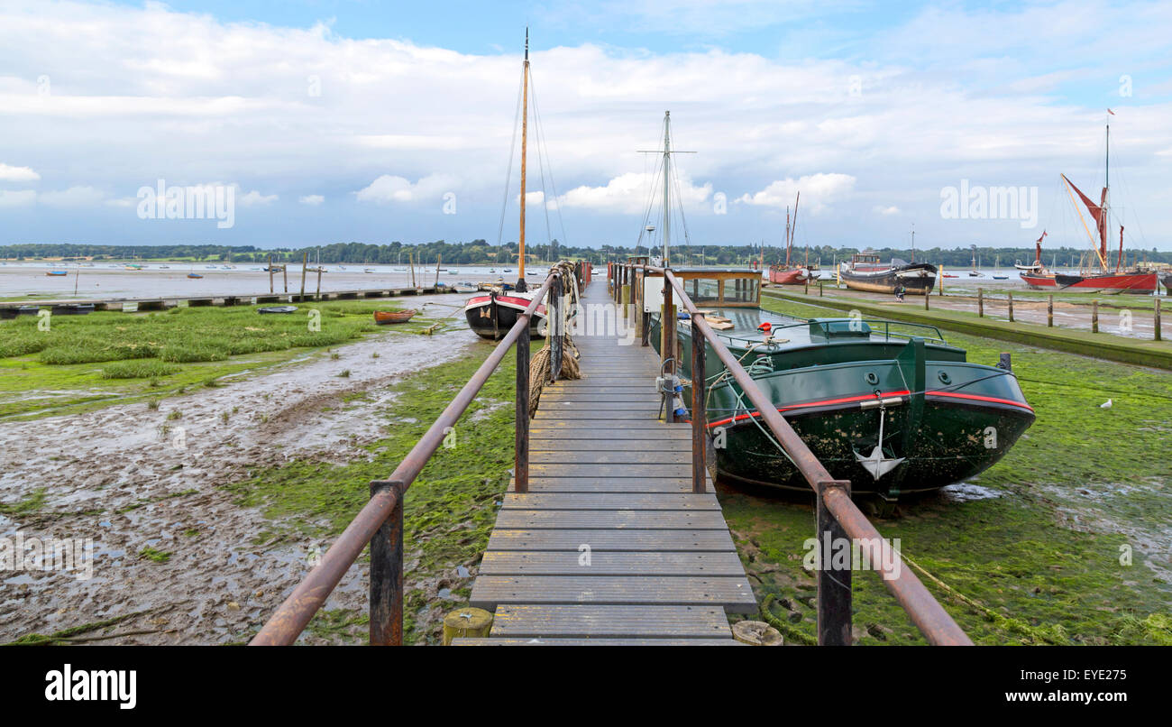 Barges at low tide on the shore at Pin Mill, on River Orwell, south ...