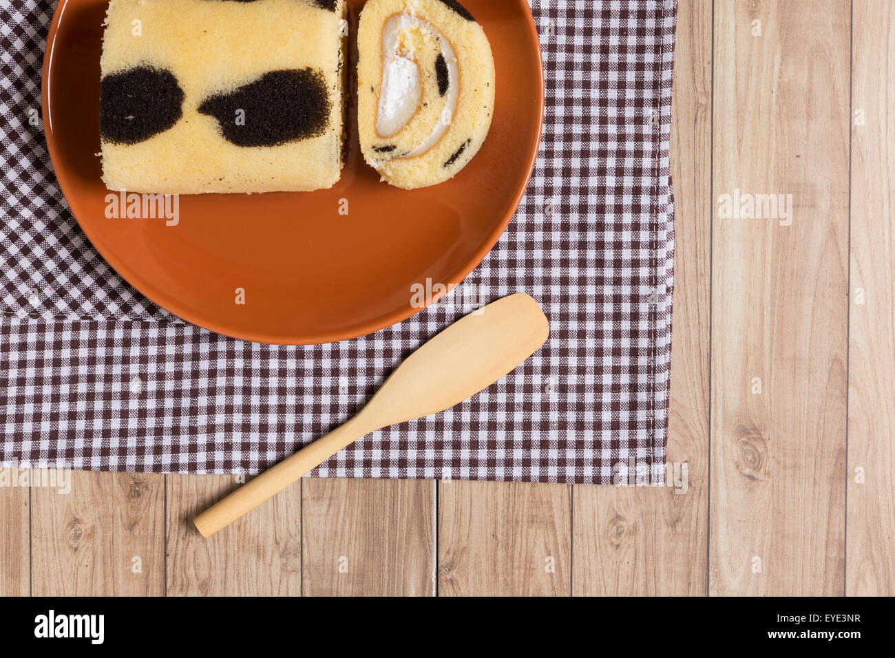Cake roll with cow-skin pattern inserted with fresh milk cream Stock ...