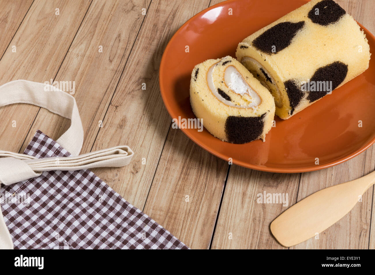 Cake roll with cow-skin pattern inserted with fresh milk cream Stock ...