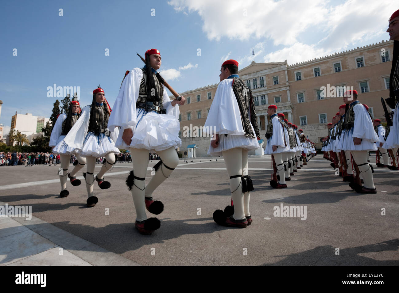 Marching Evzones after changing the guards and tourist crowds attending ...