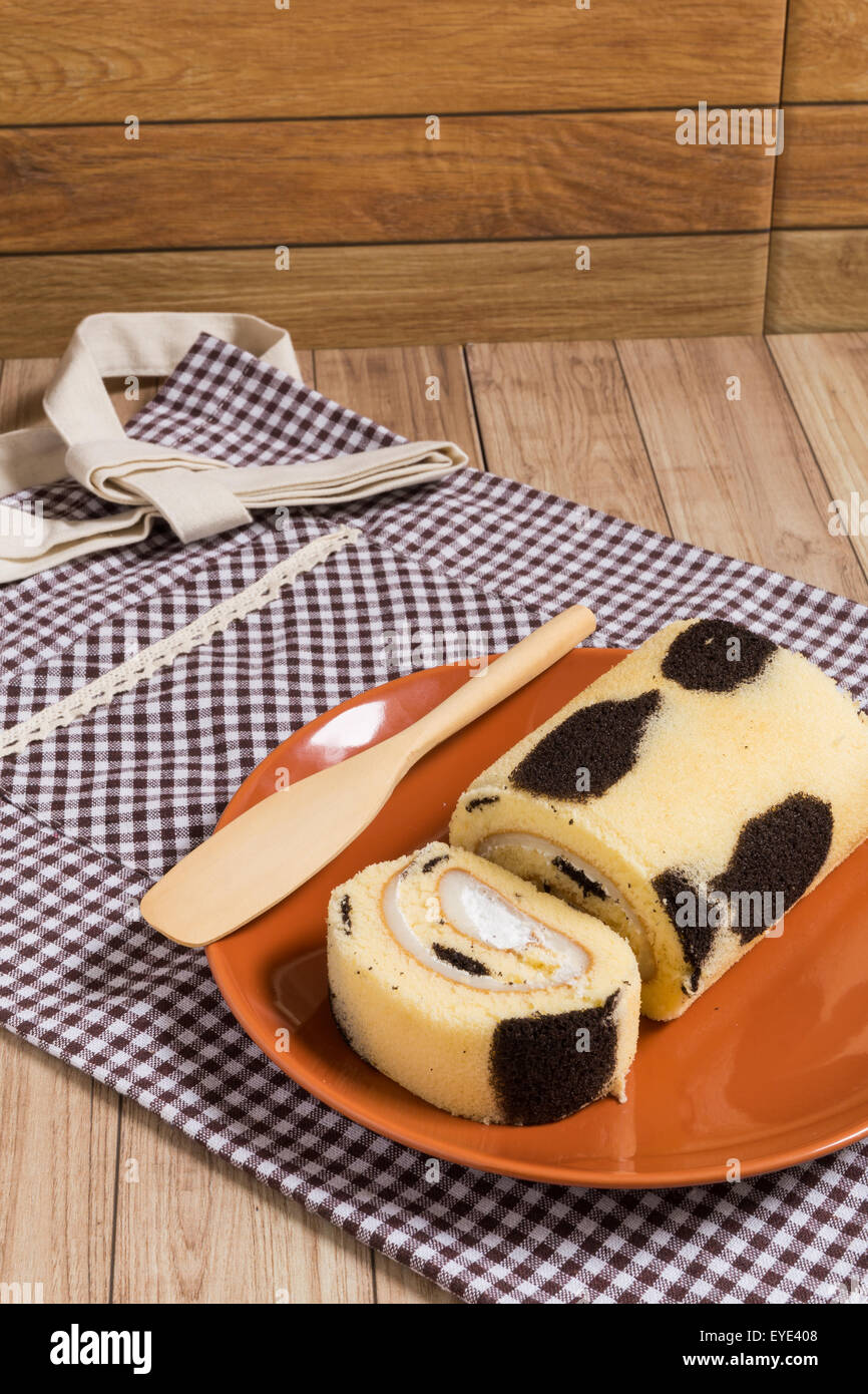 Cake roll with cow-skin pattern inserted with fresh milk cream Stock ...