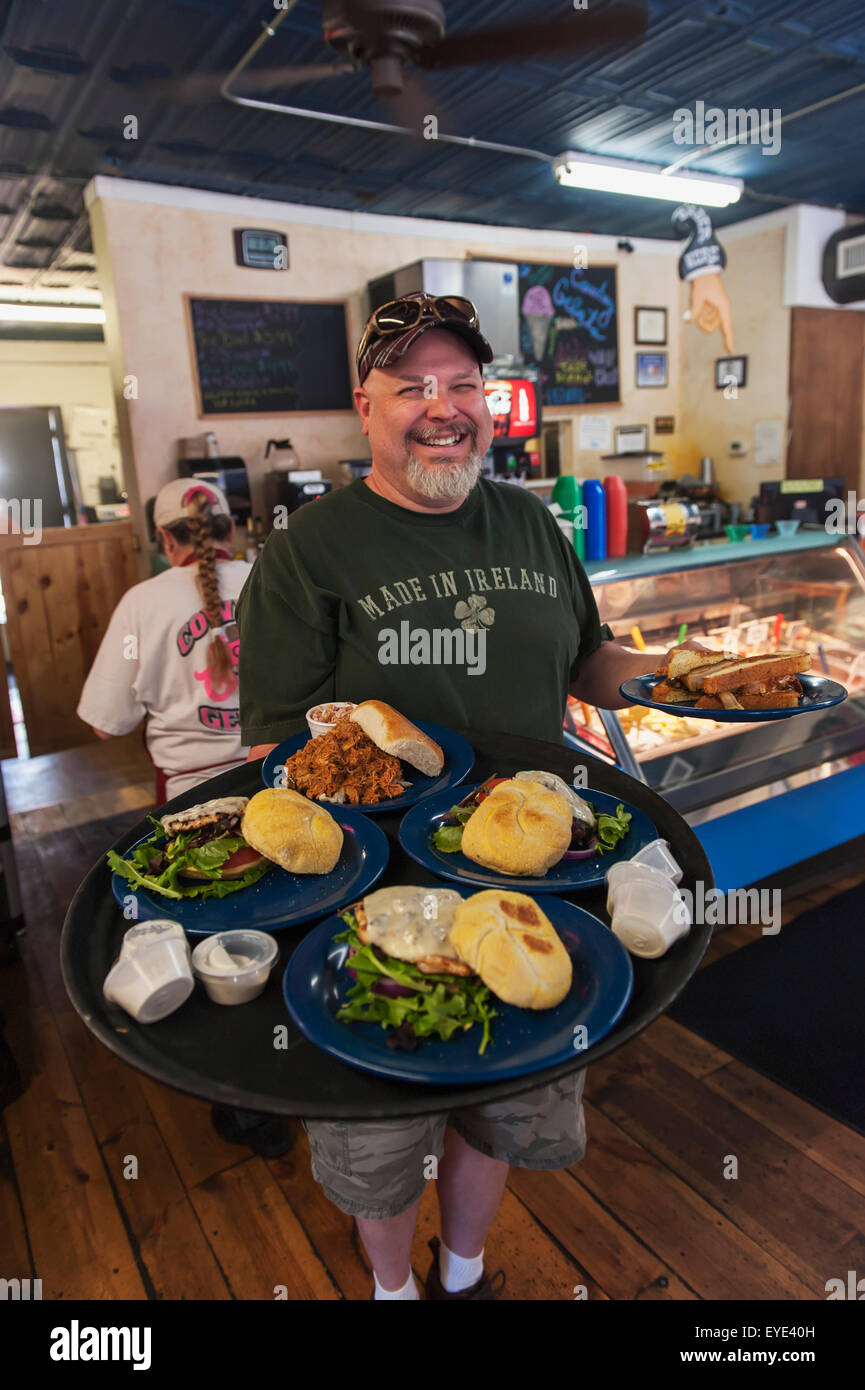 The Cowboy Gelato Restaurant Owner Jim Anderson Serving A Selection Of ...