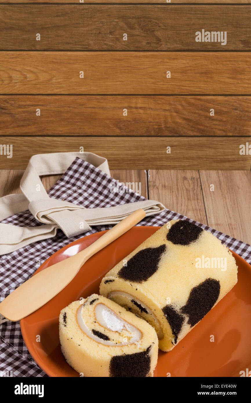 Cake roll with cow-skin pattern inserted with fresh milk cream Stock ...