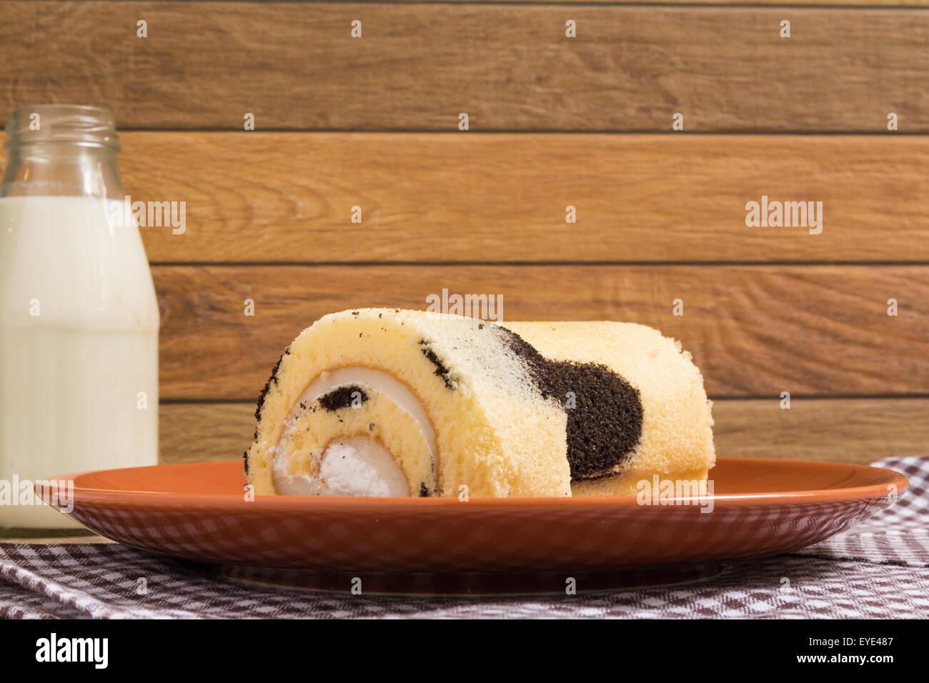Cake roll with cow-skin pattern inserted with fresh milk cream Stock ...