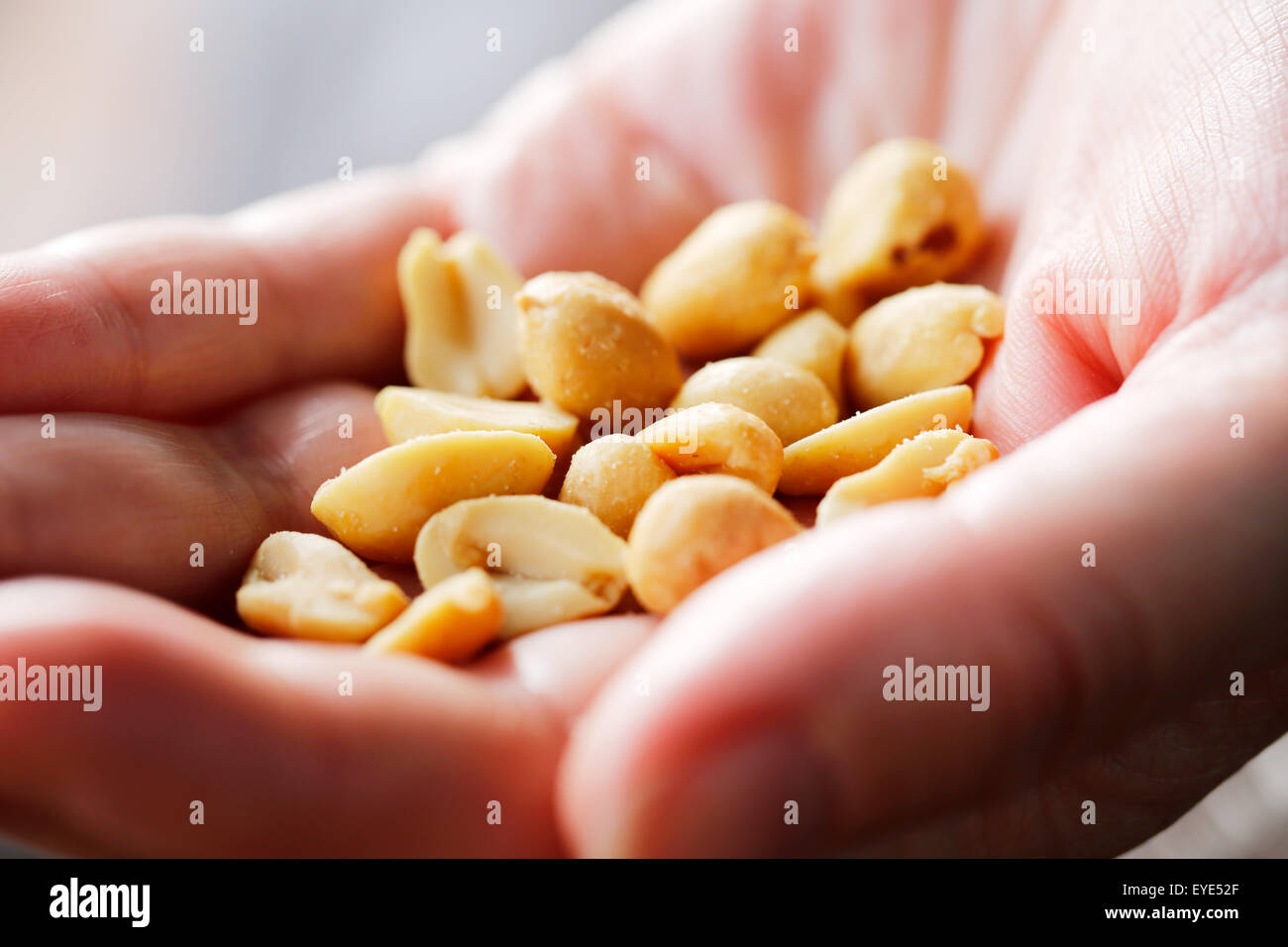 A small handful of freshly roasted, salted peanuts. A healthy snack ...