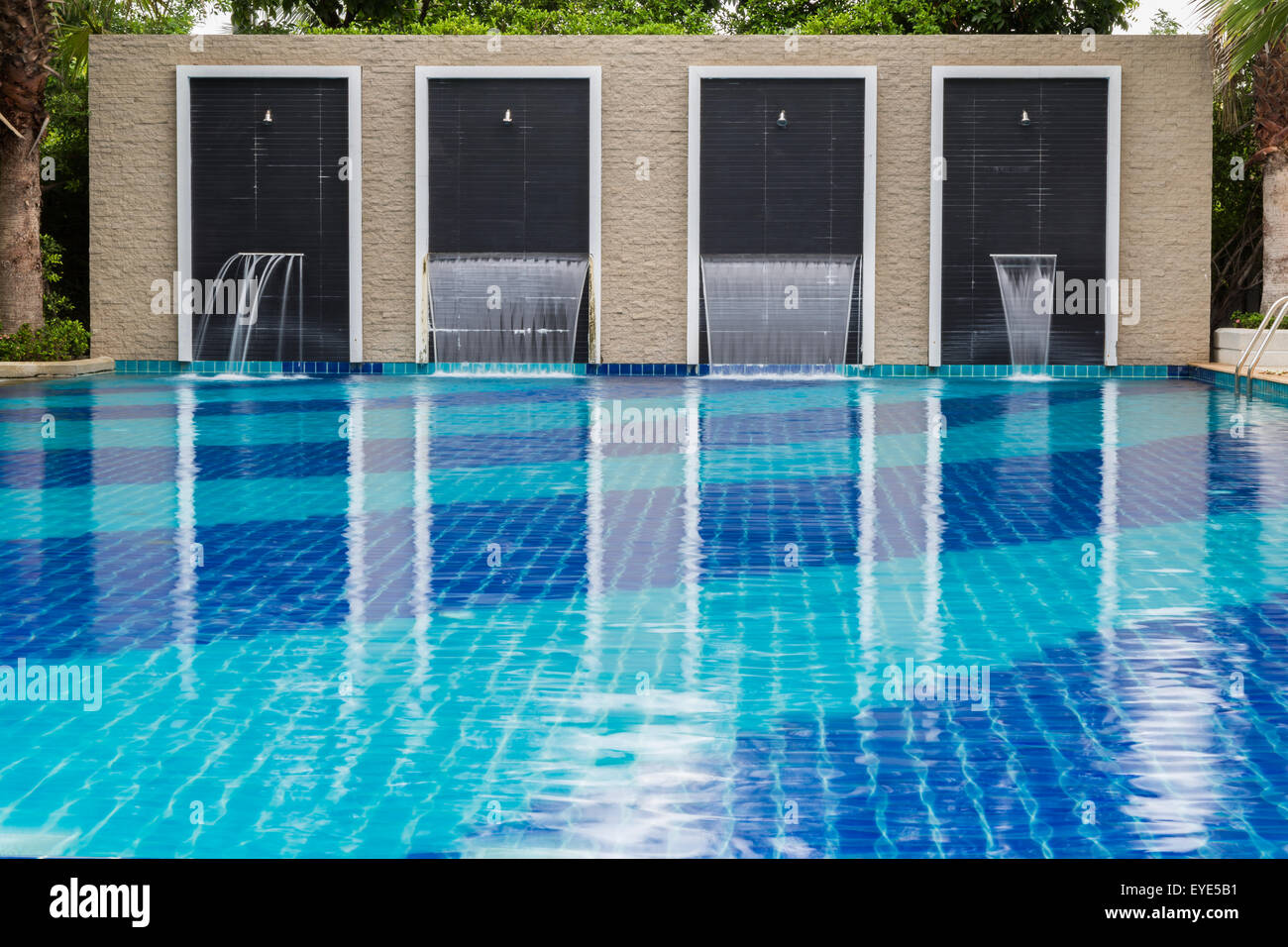 Outdoor swimming pool in garden during summer Stock Photo - Alamy
