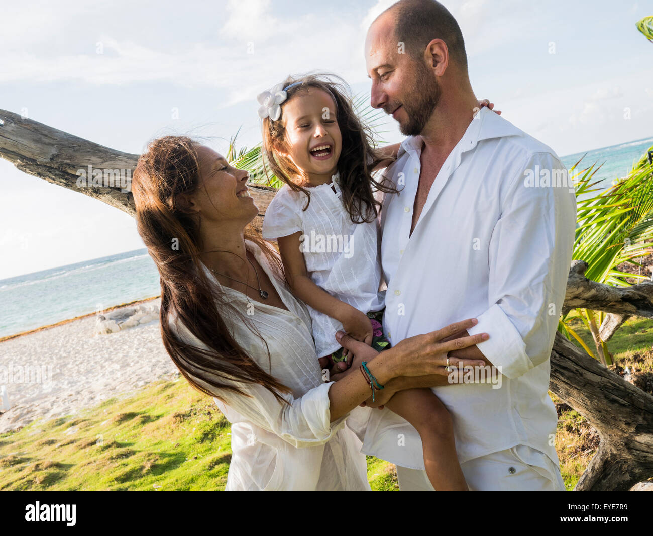 Close up Happy Small Family with One Child, Wearing White Fashion ...