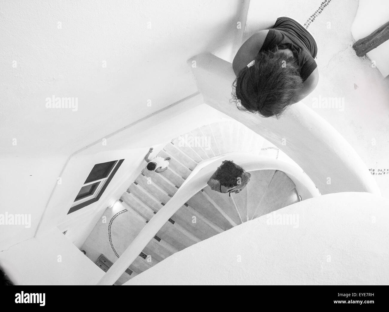 High Angle View of People Looking Down on Modern White Staircase Inside ...