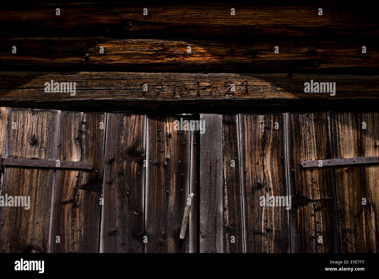 Typical old Alpine timber hut doors above Corvara in the Dolomites ...