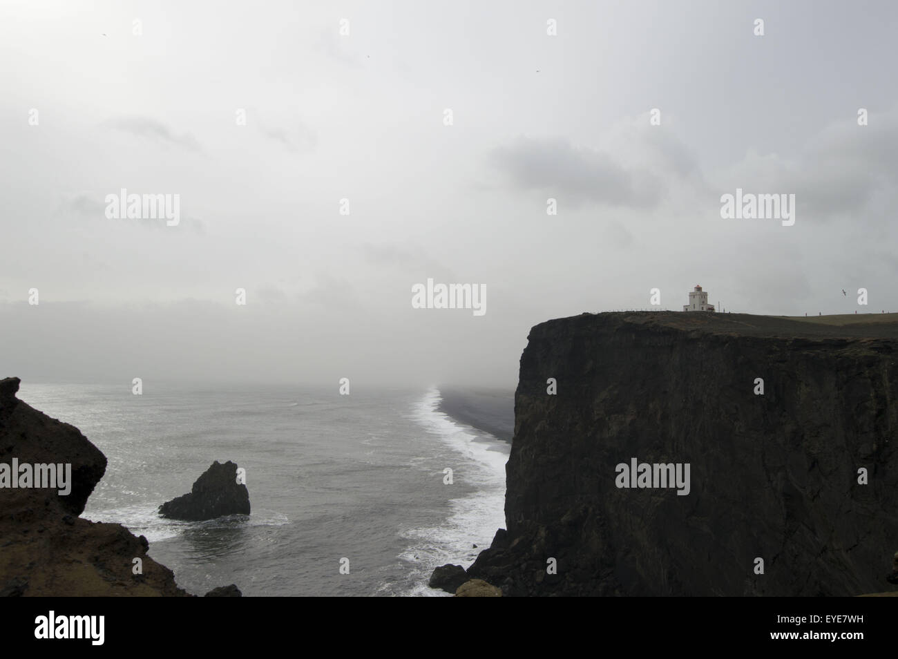 Lighthouse Rocks dramatic Stock Photo - Alamy