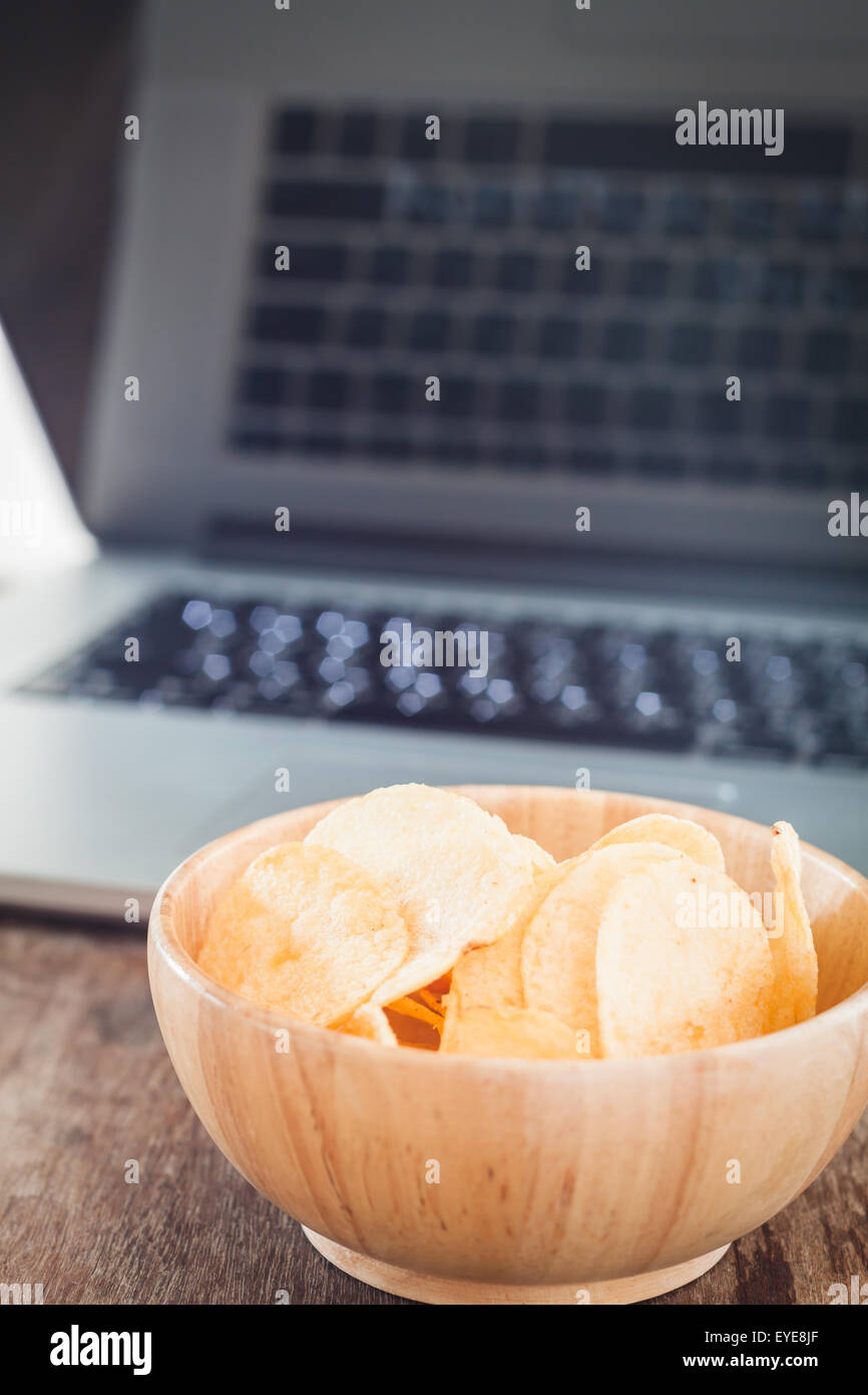Crispy potato chips on work station, stock photo Stock Photo - Alamy