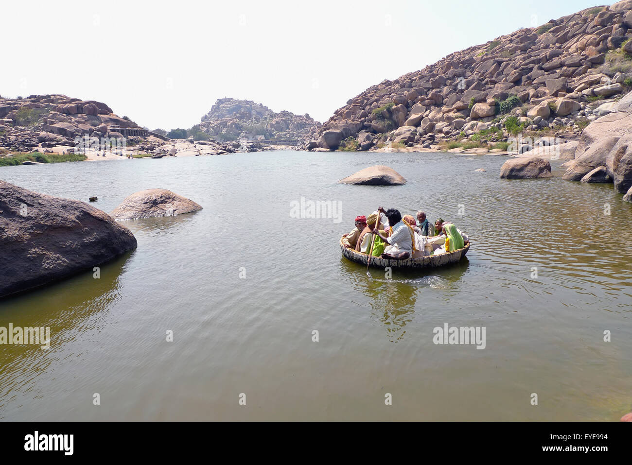 Pilgrims Float In Conical Boat Made Of Bamboo Along The Tungabhadra ...