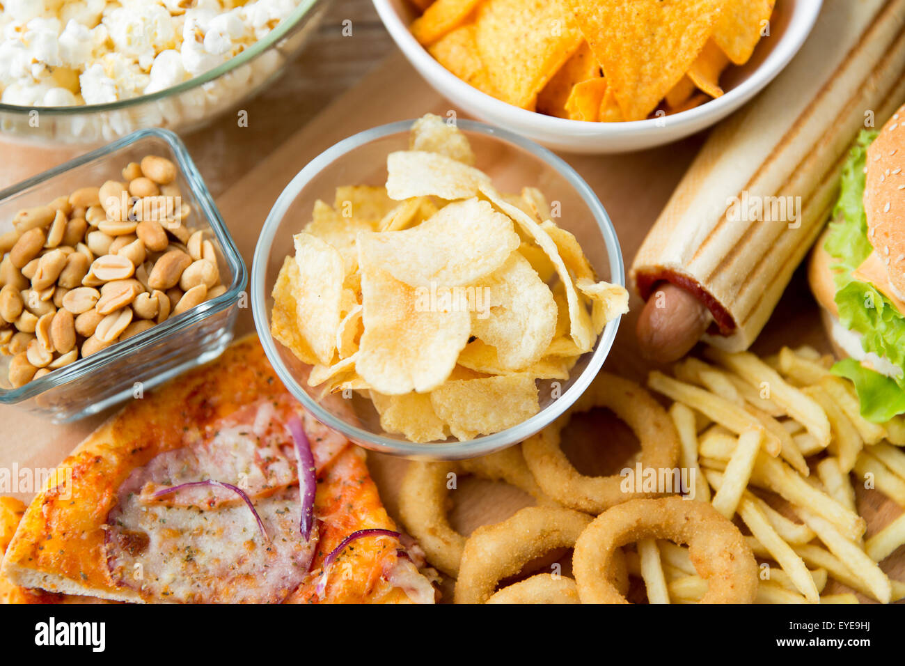 close up of fast food snacks and drink on table Stock Photo - Alamy