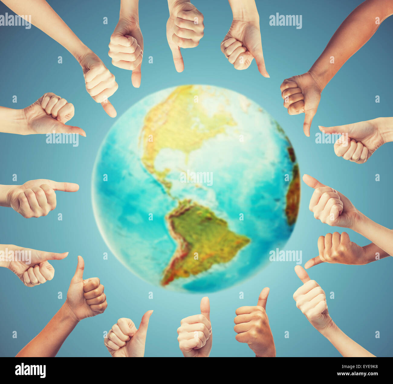 human hands showing thumbs up in circle over earth Stock Photo - Alamy