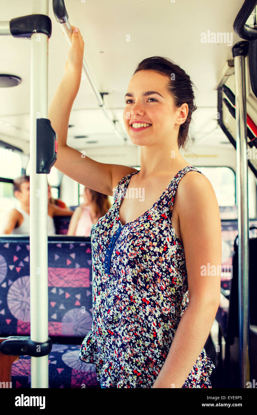 smiling teenage girl going by bus Stock Photo - Alamy