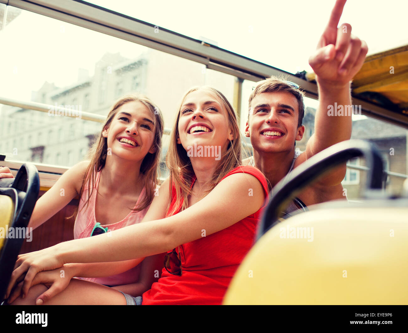 group of smiling friends traveling by tour bus Stock Photo - Alamy