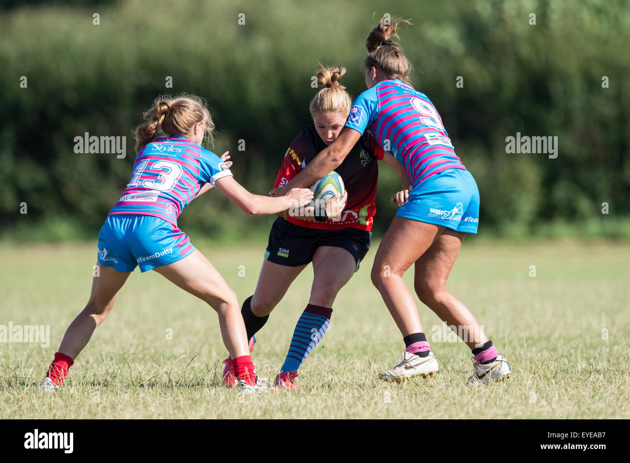 Female rugby player is tackled hi-res stock photography and images - Alamy