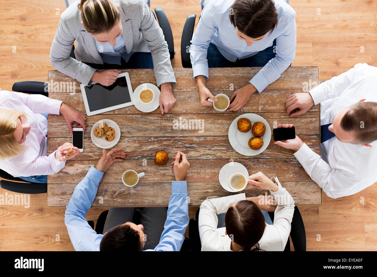 close up of business team drinking coffee on lunch Stock Photo - Alamy