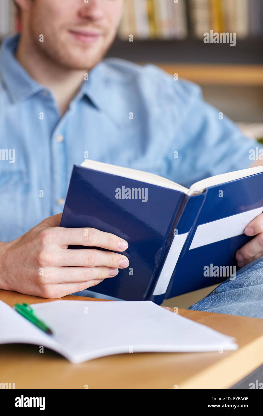 close up of student reading book at school Stock Photo - Alamy
