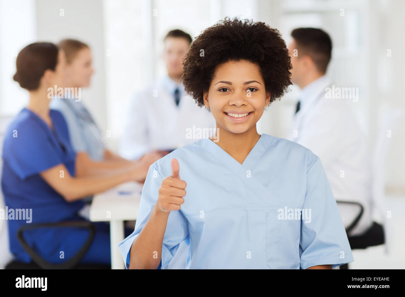 happy doctor over group of medics at hospital Stock Photo - Alamy