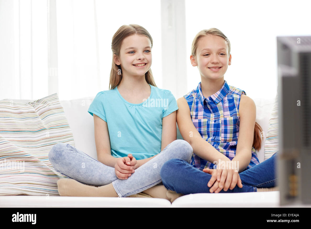 Two female friends watching movie hi-res stock photography and images ...