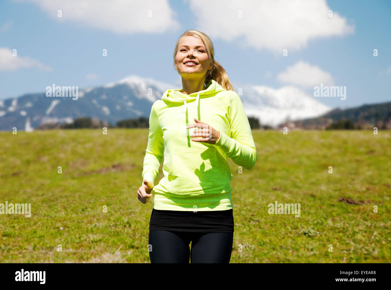 happy young smiling woman jogging outdoors Stock Photo - Alamy