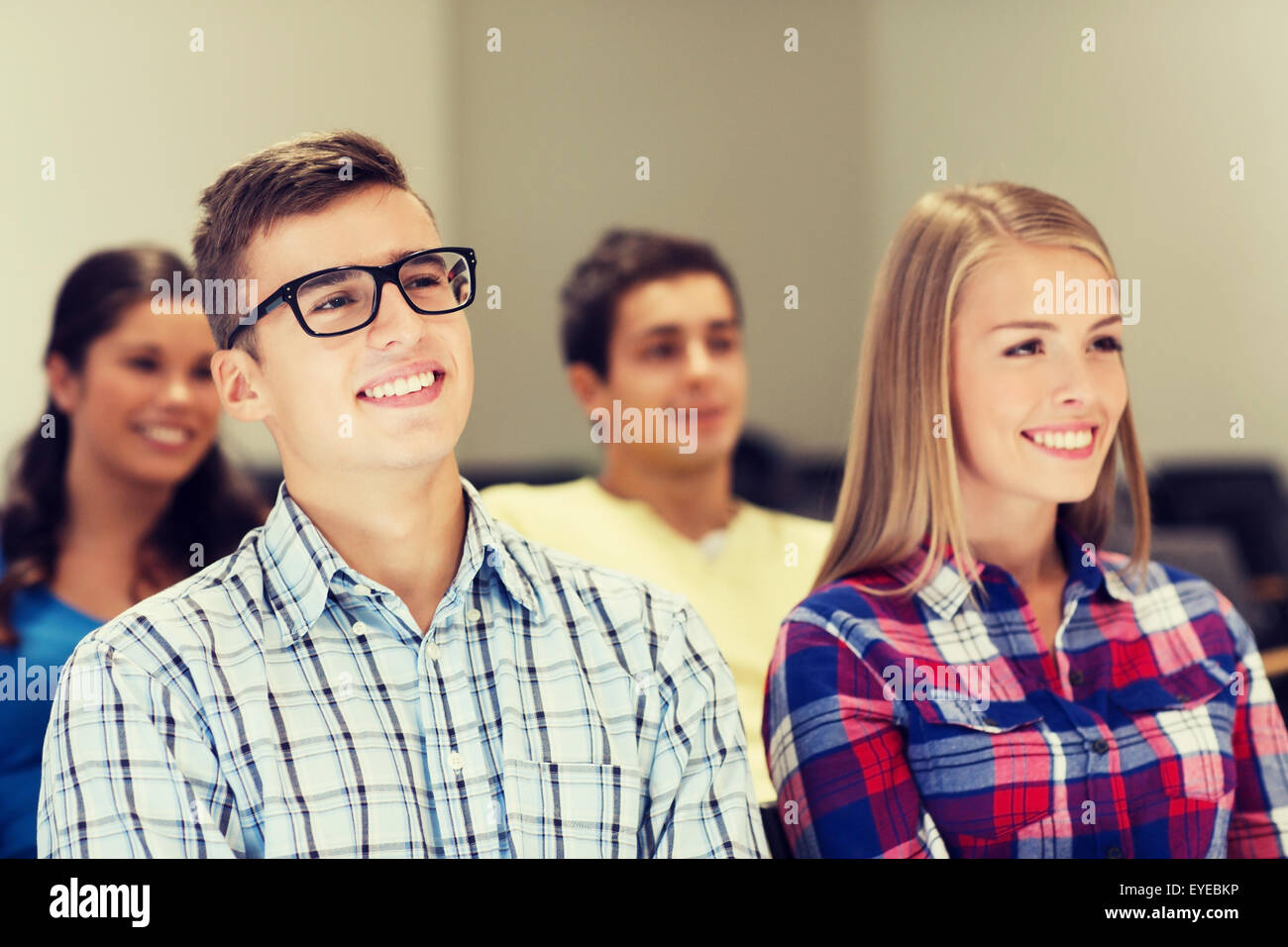 group of smiling students in lecture hall Stock Photo - Alamy