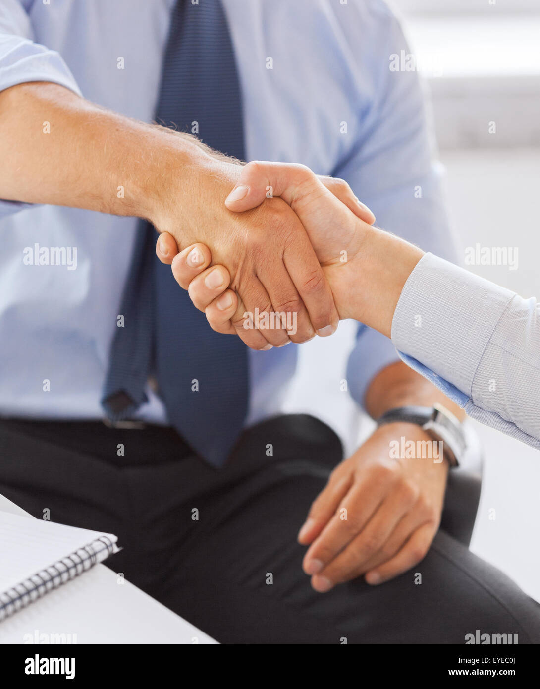businessmen shaking hands in office Stock Photo - Alamy