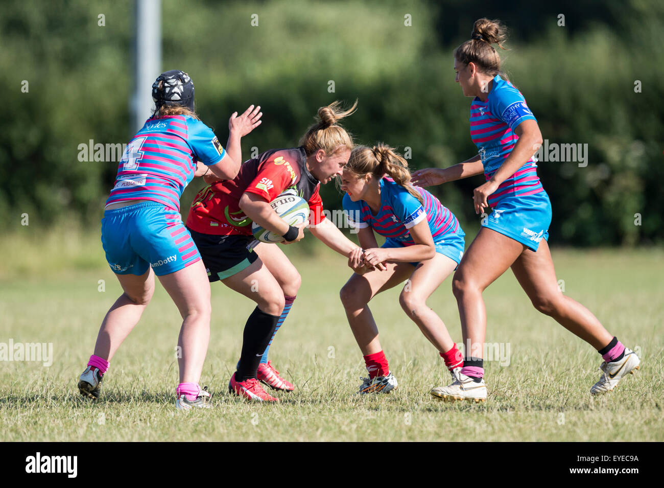 Female rugby players in action Stock Photo - Alamy