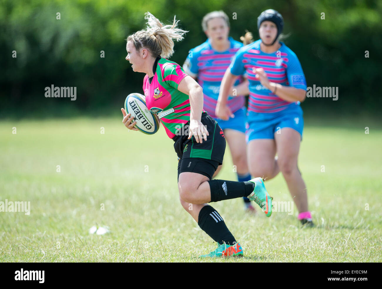 Female rugby players in action Stock Photo - Alamy