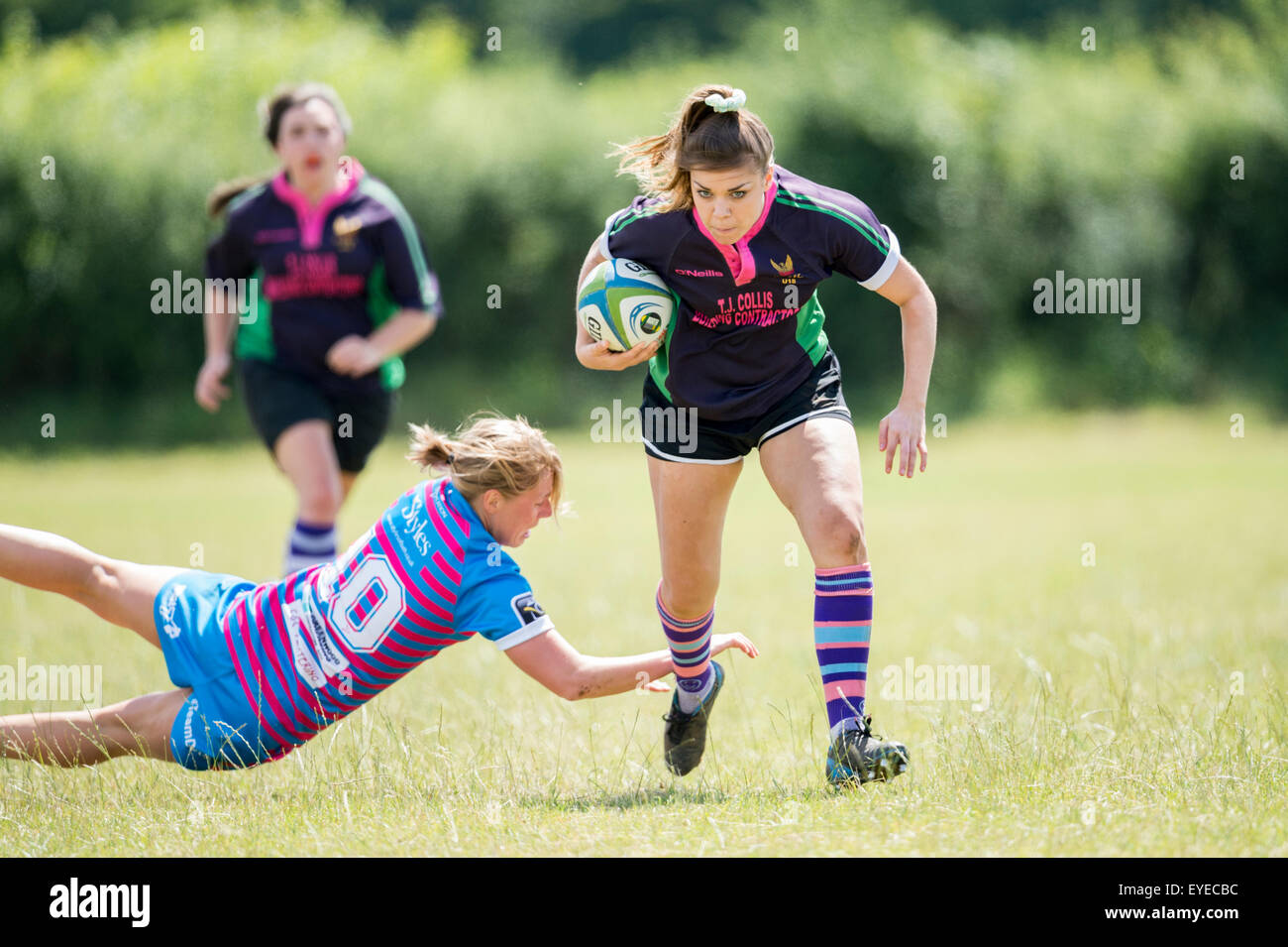 Female rugby players in action Stock Photo - Alamy