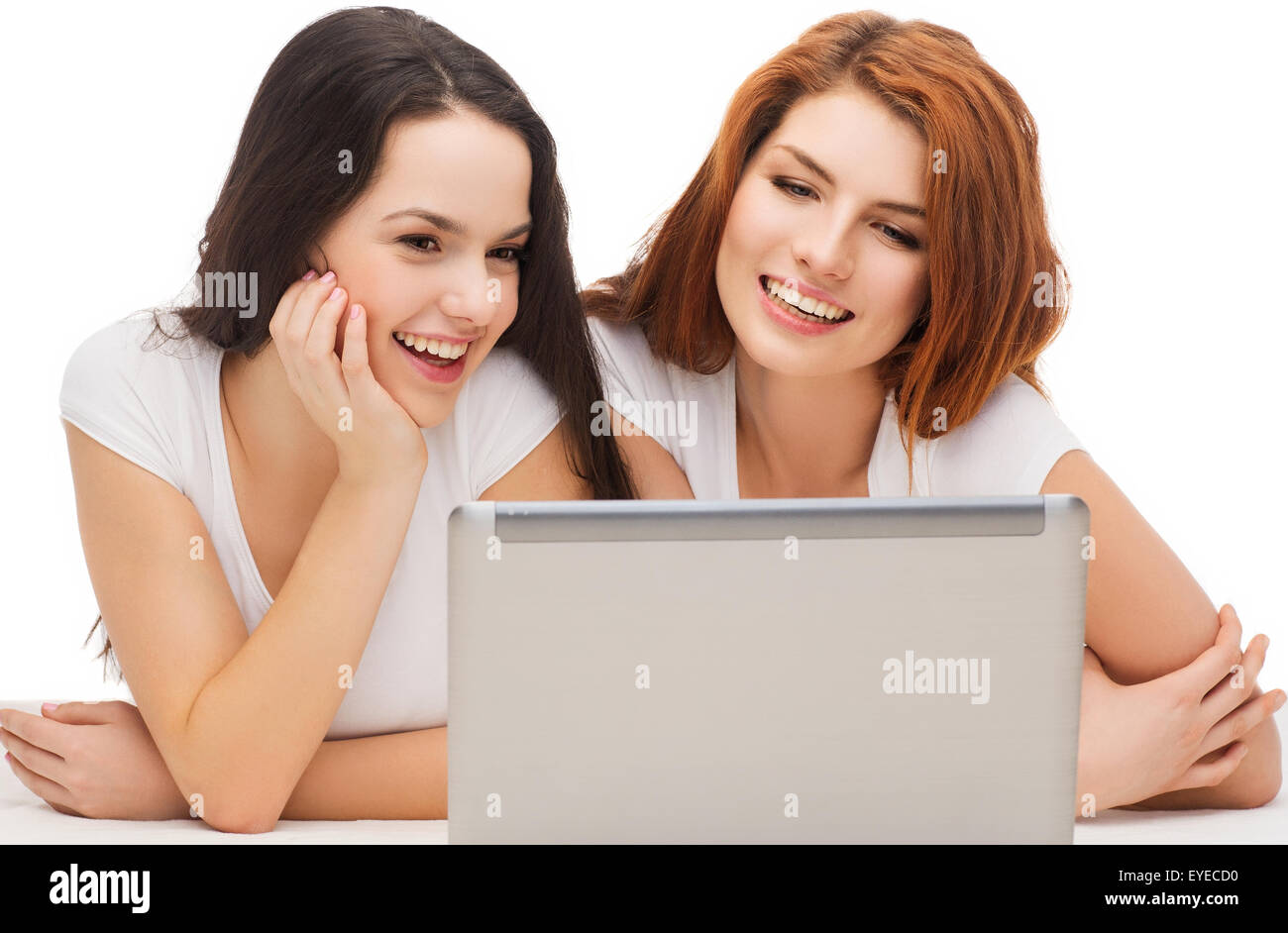 two smiling teenage girls with laptop computer Stock Photo - Alamy