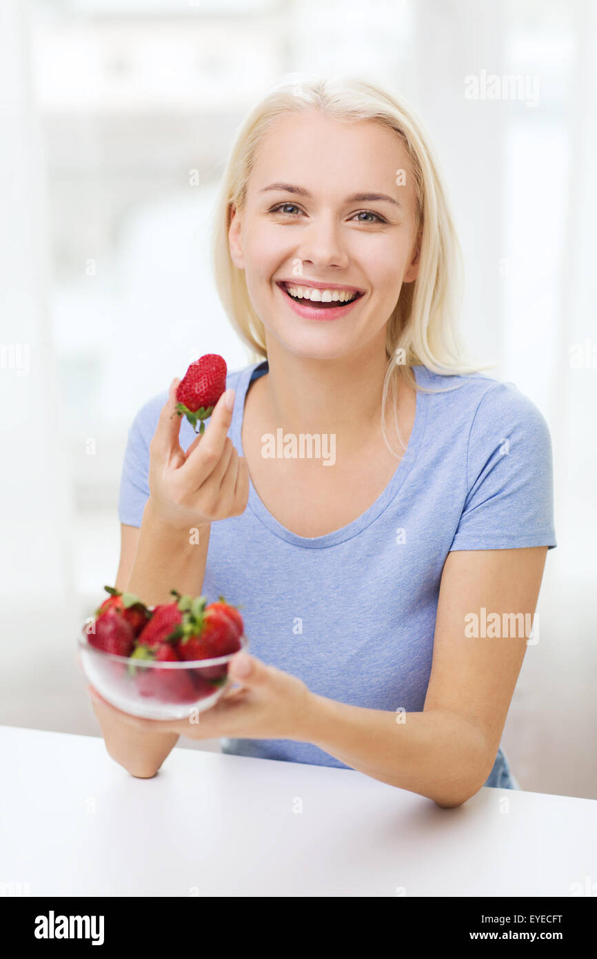 Woman eating berries hi-res stock photography and images - Alamy