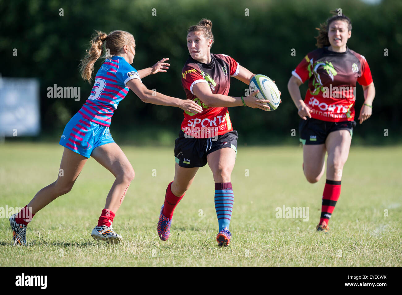 Female rugby players in action Stock Photo - Alamy