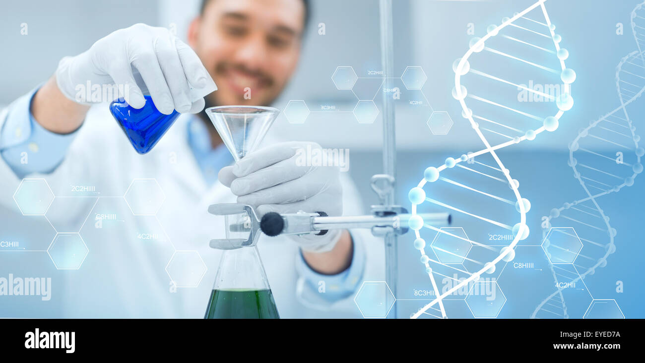 close up of scientist with test tubes and funnel Stock Photo - Alamy