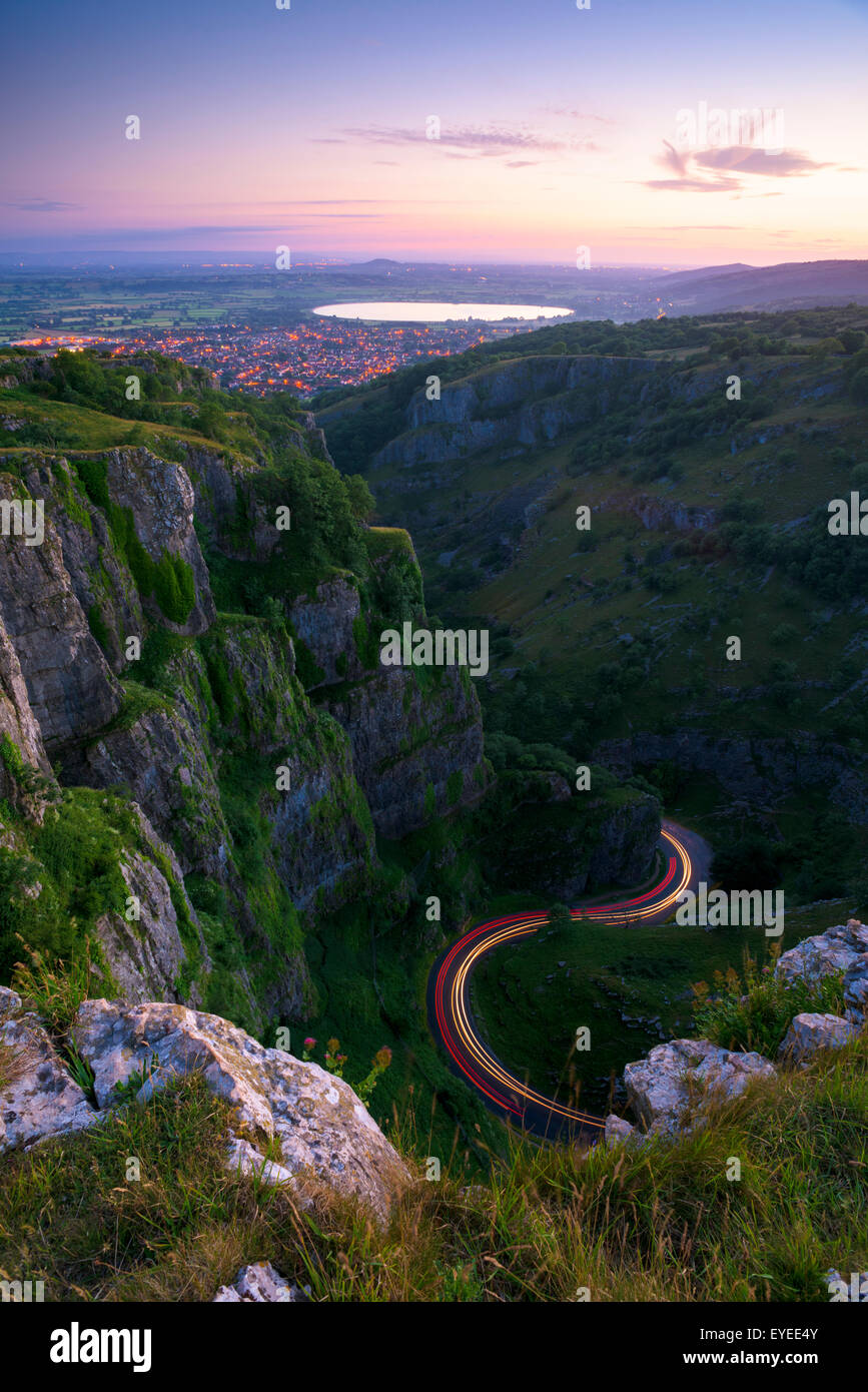 Cheddar Gorge from the top of the cliffs at dusk with traffic on the ...