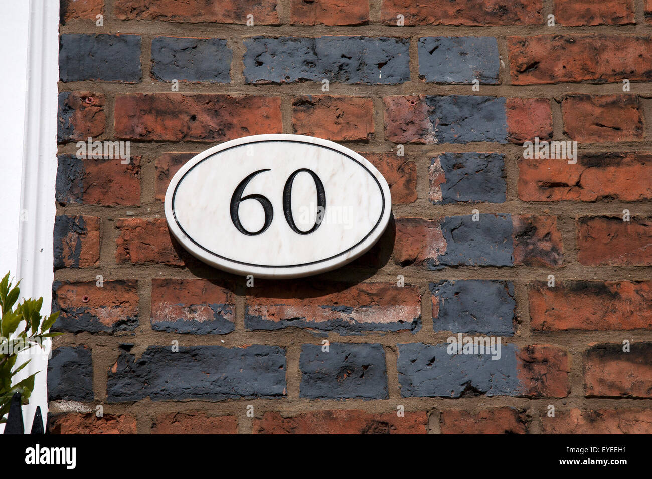 Sixty Number Sign on a Red Brick Wall Stock Photo - Alamy