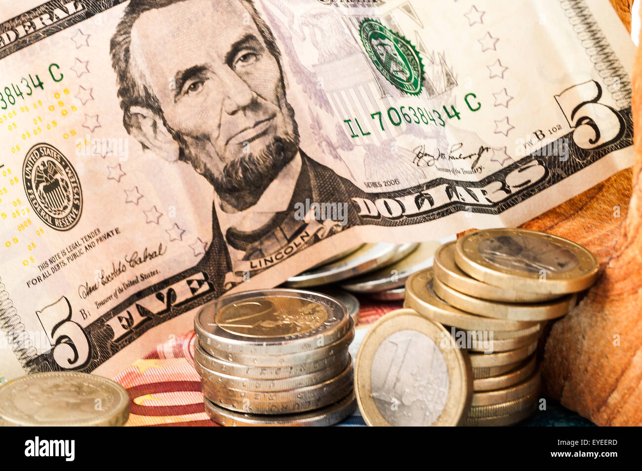 Money Euro Dollar Bill Coins 5 Bucks, one and two Euro Coins Stock ...