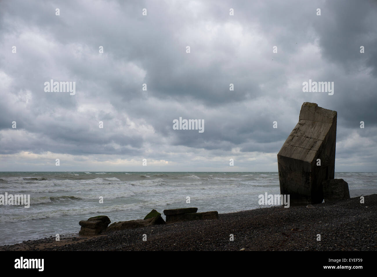 WW2 blockhouse on beach, stormy sky, St Marguerite-sur-Mer, Normandy ...