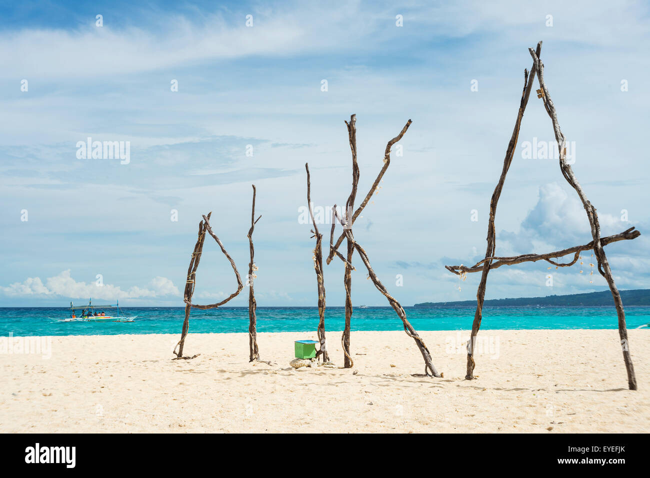 Puka beach in Boracay, white sand and blue water, with the work puka ...