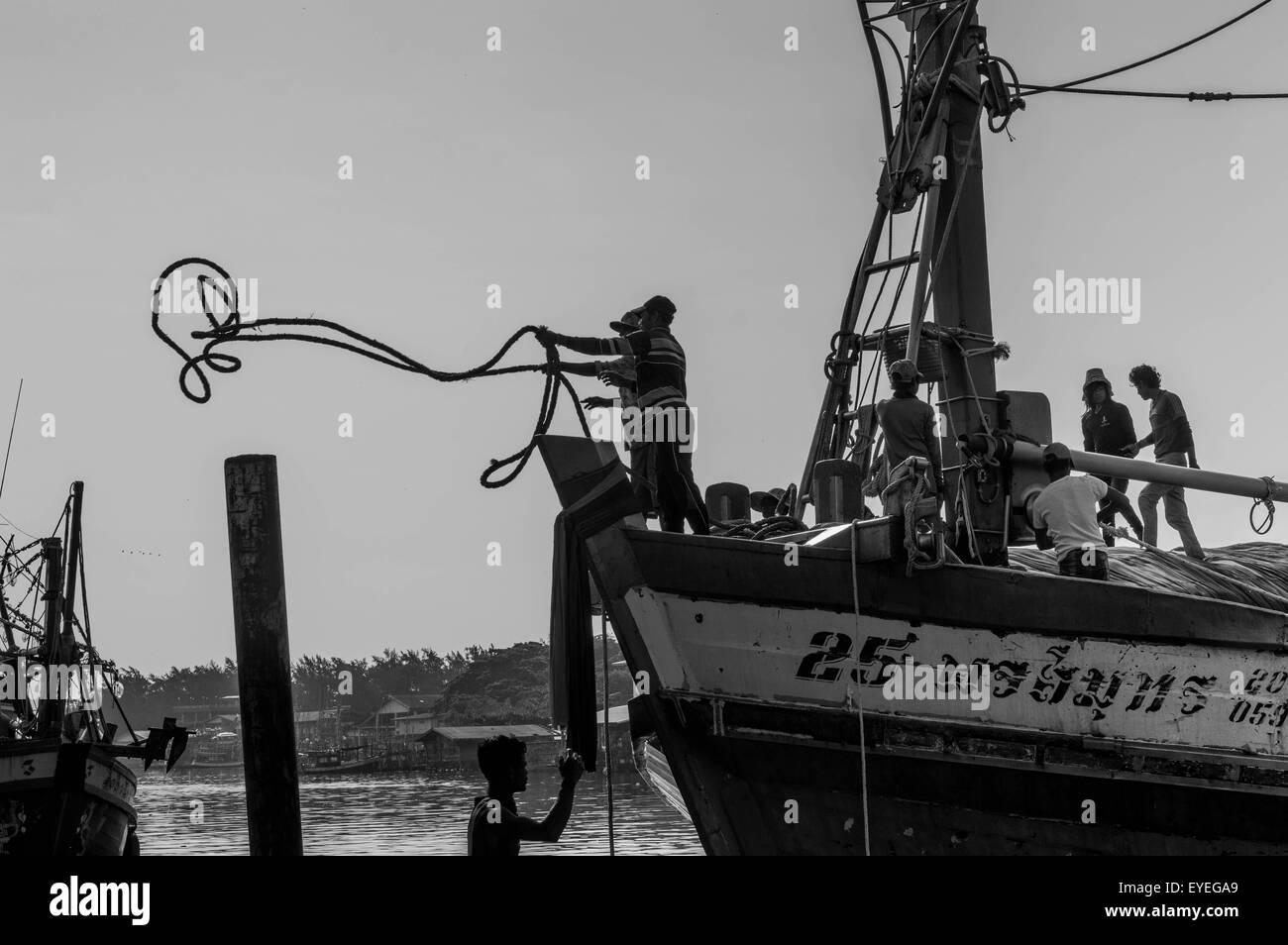Fish landing on boat Black and White Stock Photos & Images - Alamy