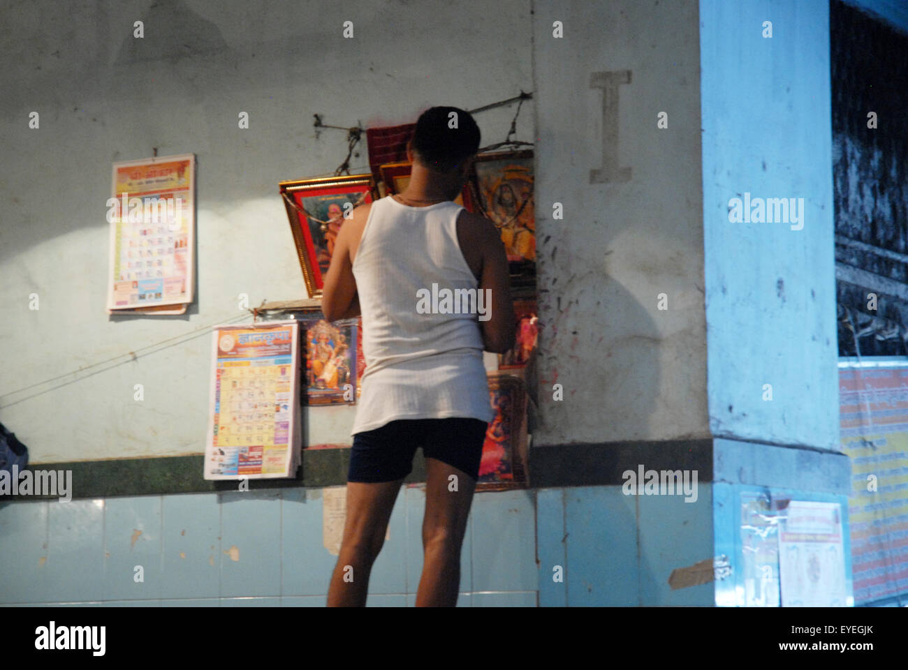 Man facing wall looking at posters, Mumbai, Maharashtra, India Stock ...