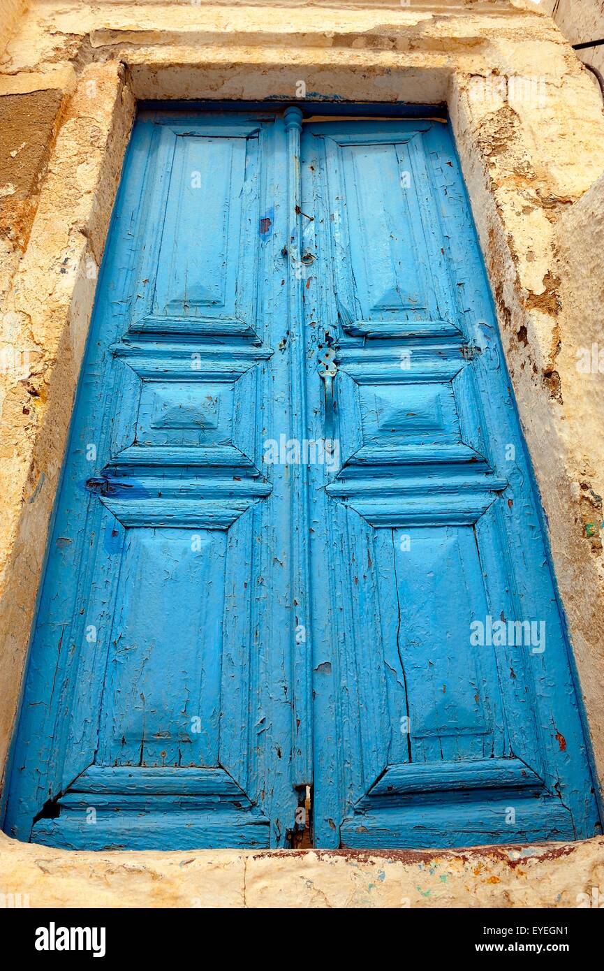 A blue rustic painted door in the village of Emporio,Santorini,Greece ...