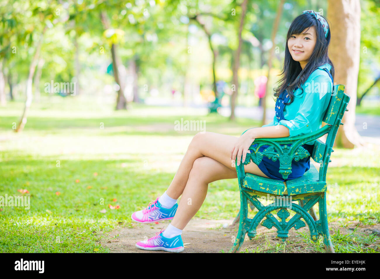Asian Girl Sitting On Bench Stock Photos & Asian Girl Sitting On Bench ...