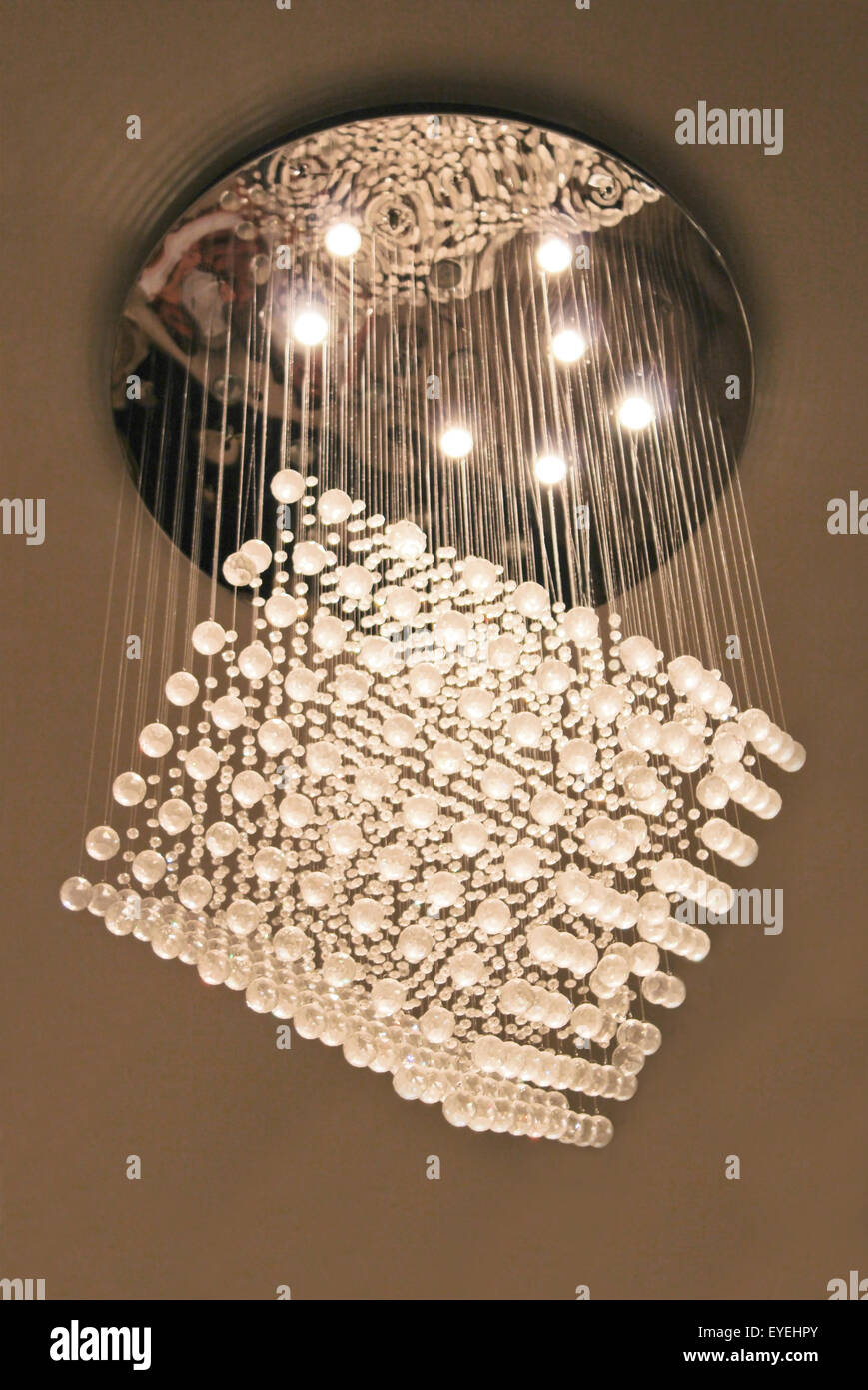 Ceiling light with dangling crystal balls on the line making up the ...