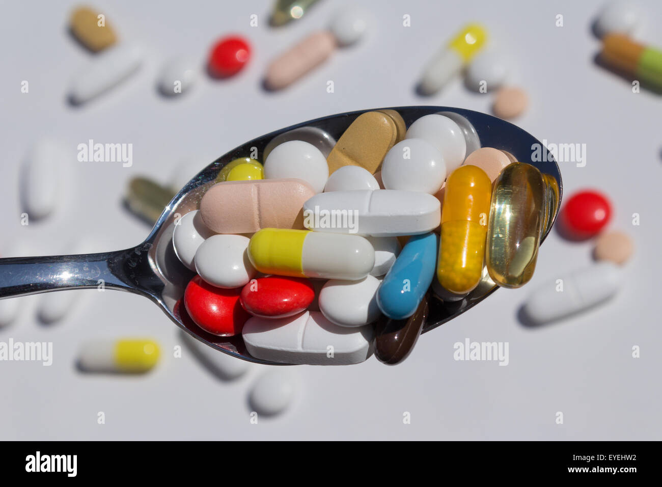 spoon of pills, capsules medication Stock Photo - Alamy